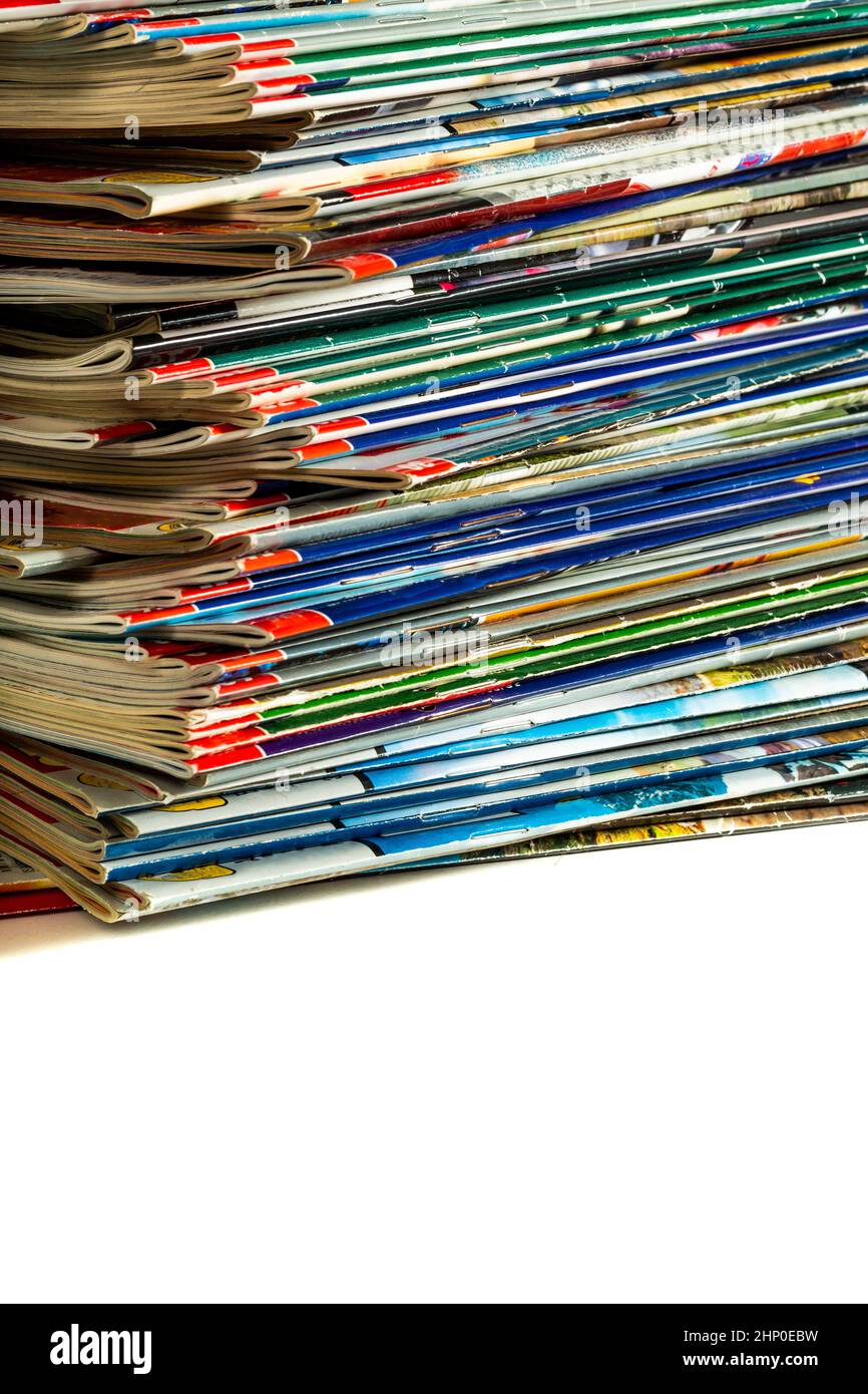 Stack of colorful magazines on light background Stock Photo - Alamy