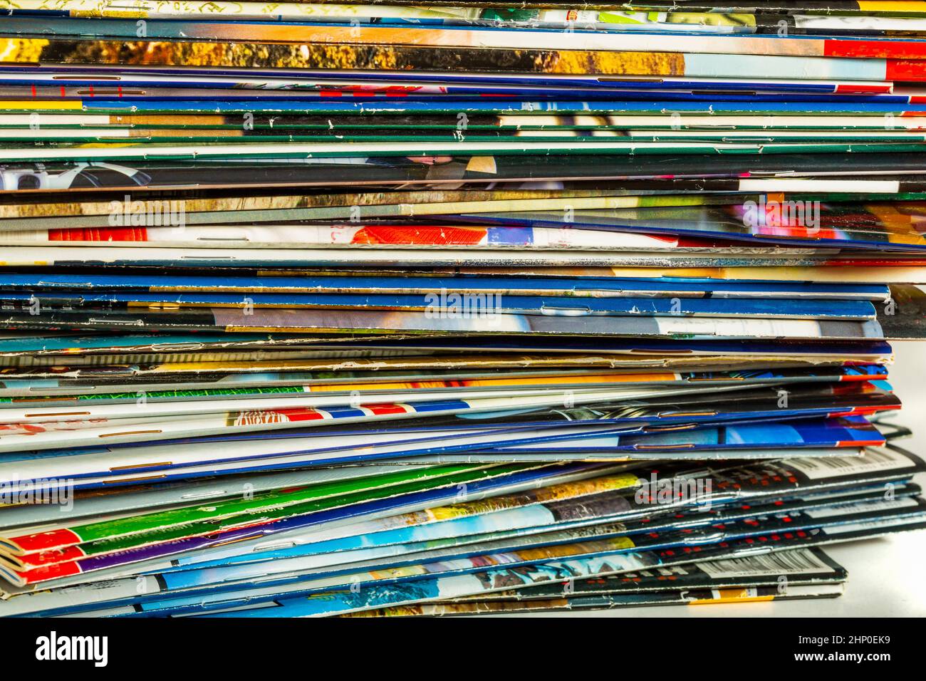 Stack of colorful magazines on light background Stock Photo - Alamy