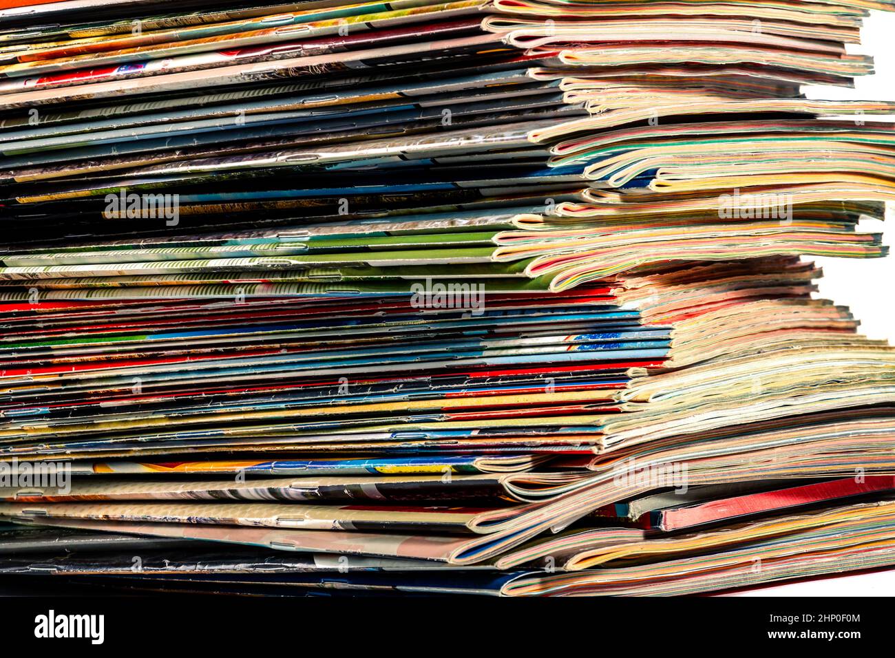 Stack of colorful magazines on light background Stock Photo - Alamy