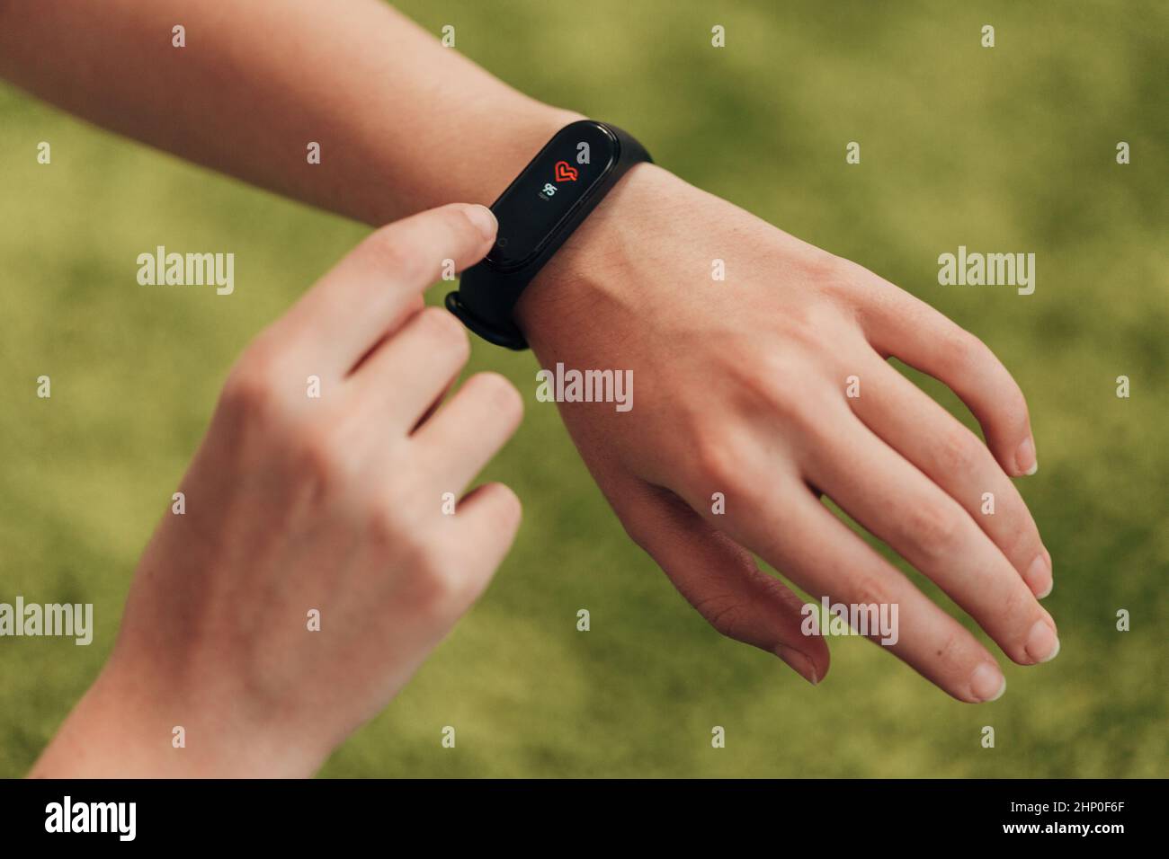 The smartwatch on the wrist measures the heartbeat. Pulse check Stock ...