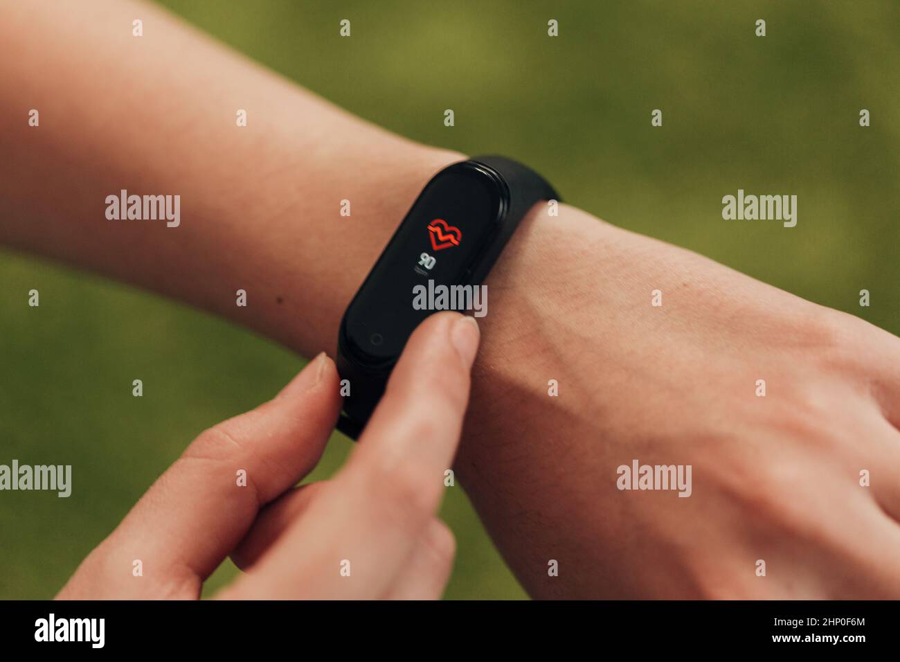 The smartwatch on the wrist measures the heartbeat. Pulse check Stock ...