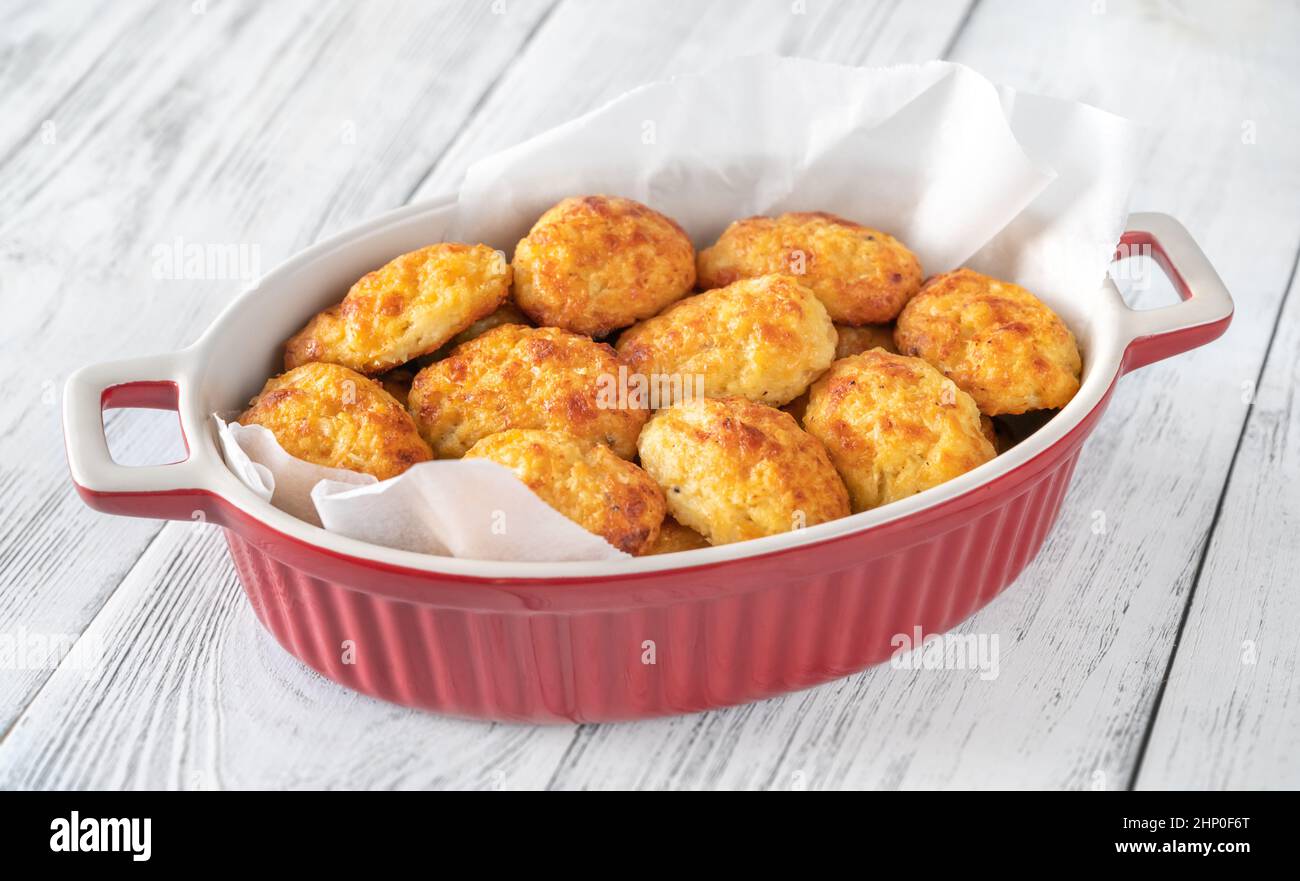Batch of baked cheesy cauliflower tots close up Stock Photo - Alamy