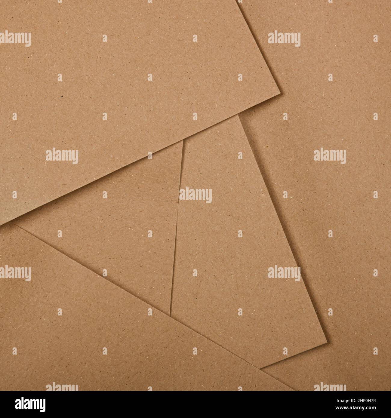 Close up abstract background of several natural brown paper sheets for ...