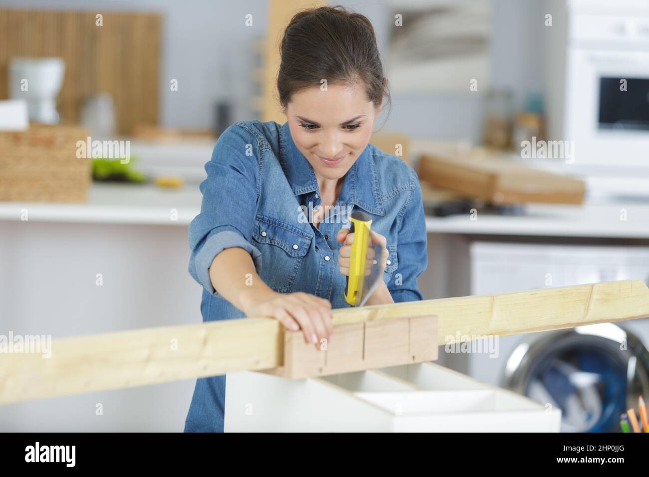 happy woman hand with saw Stock Photo - Alamy