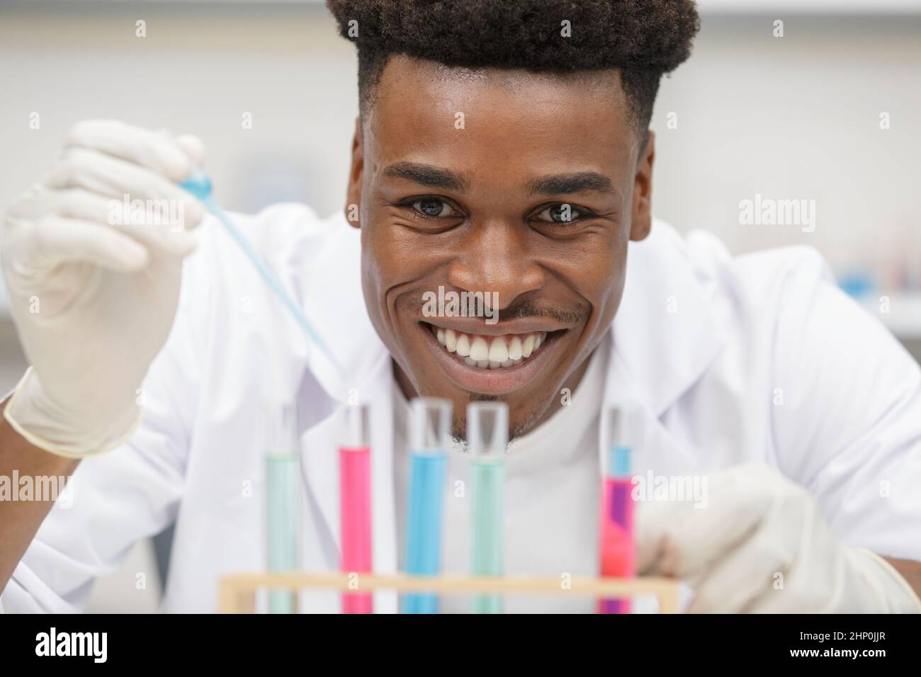 happy male lab worker doing tests in a laboratory Stock Photo - Alamy