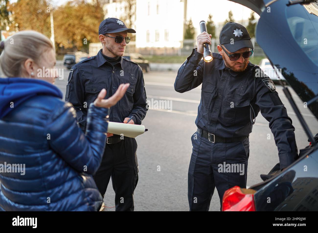 Police checking car trunk hi-res stock photography and images - Alamy