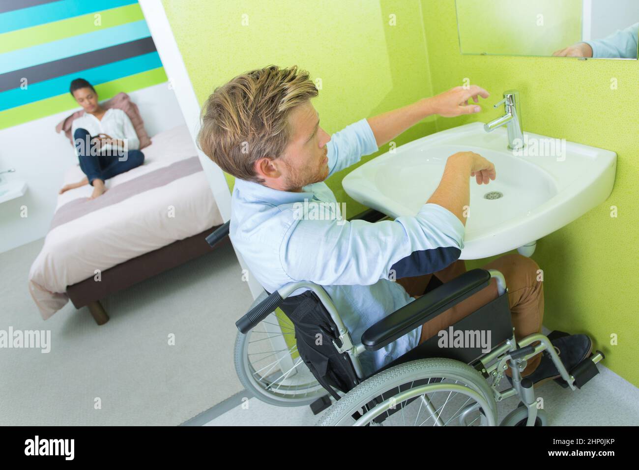 Disabled man in bathroom washing hi-res stock photography and images ...