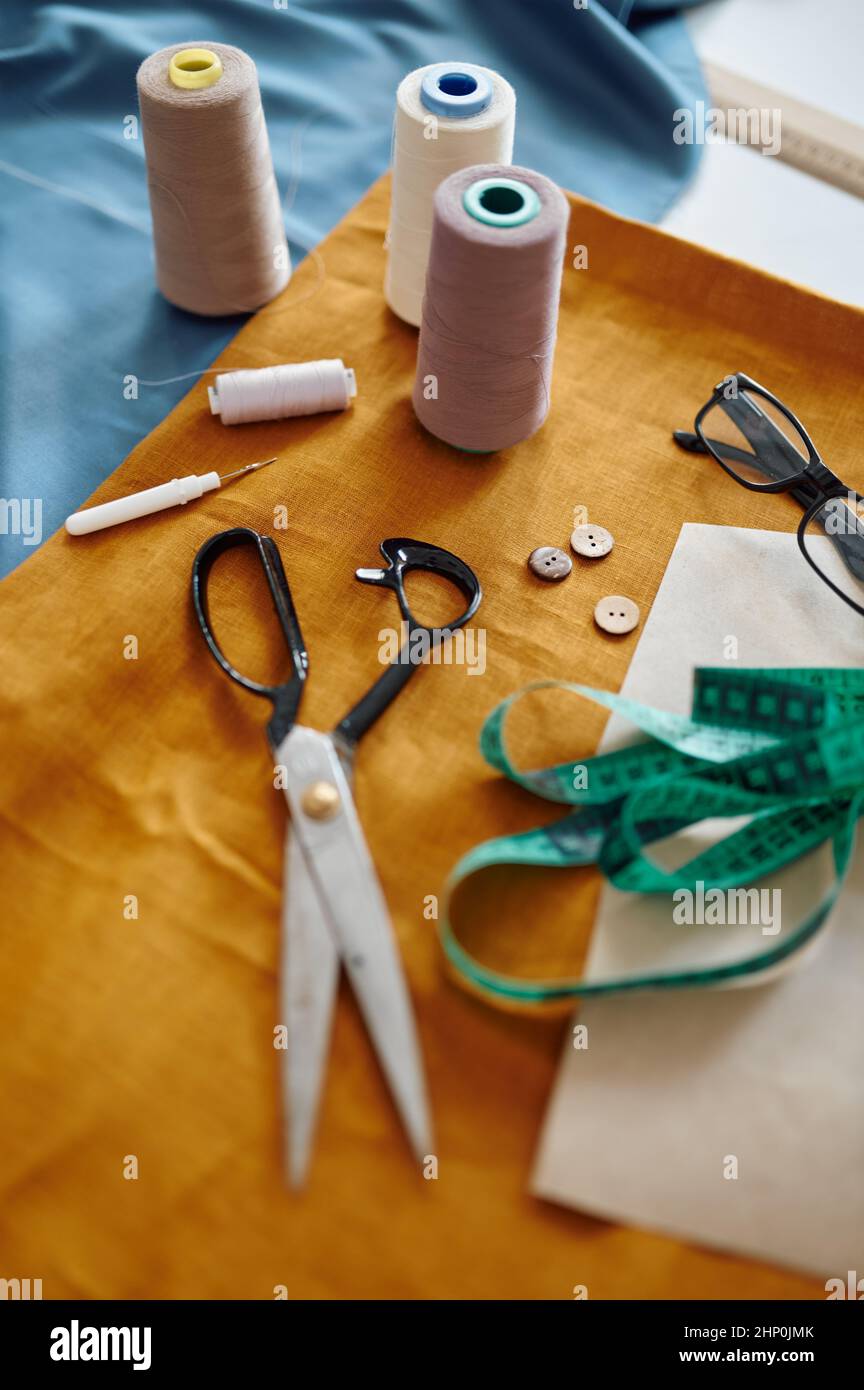 Dressmaking tools on the table, top view, nobody. Professional sewing ...