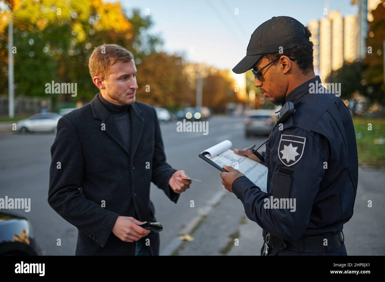 Officer checking license hi-res stock photography and images - Alamy