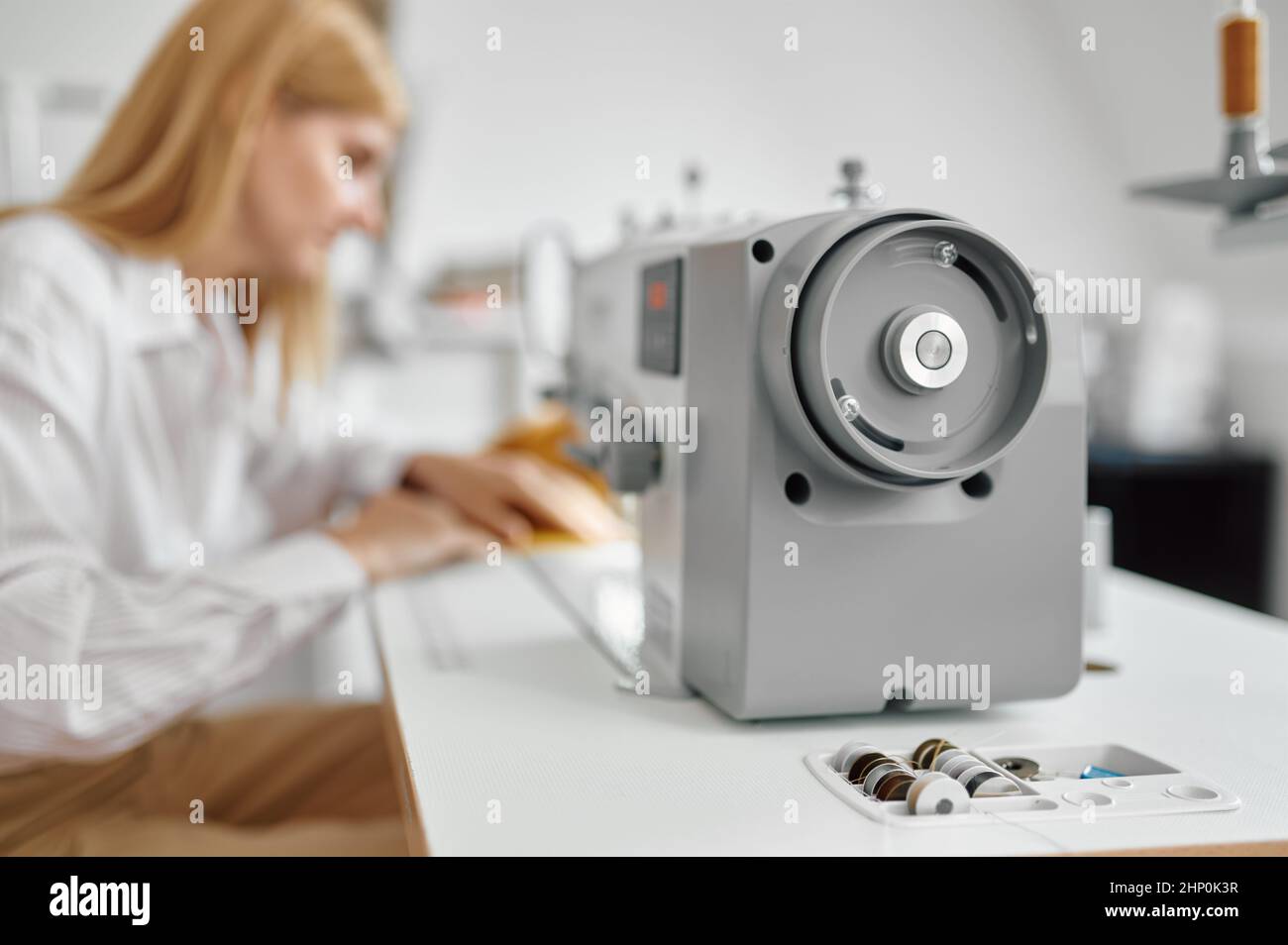 Woman works on sewing machine hi-res stock photography and images - Alamy