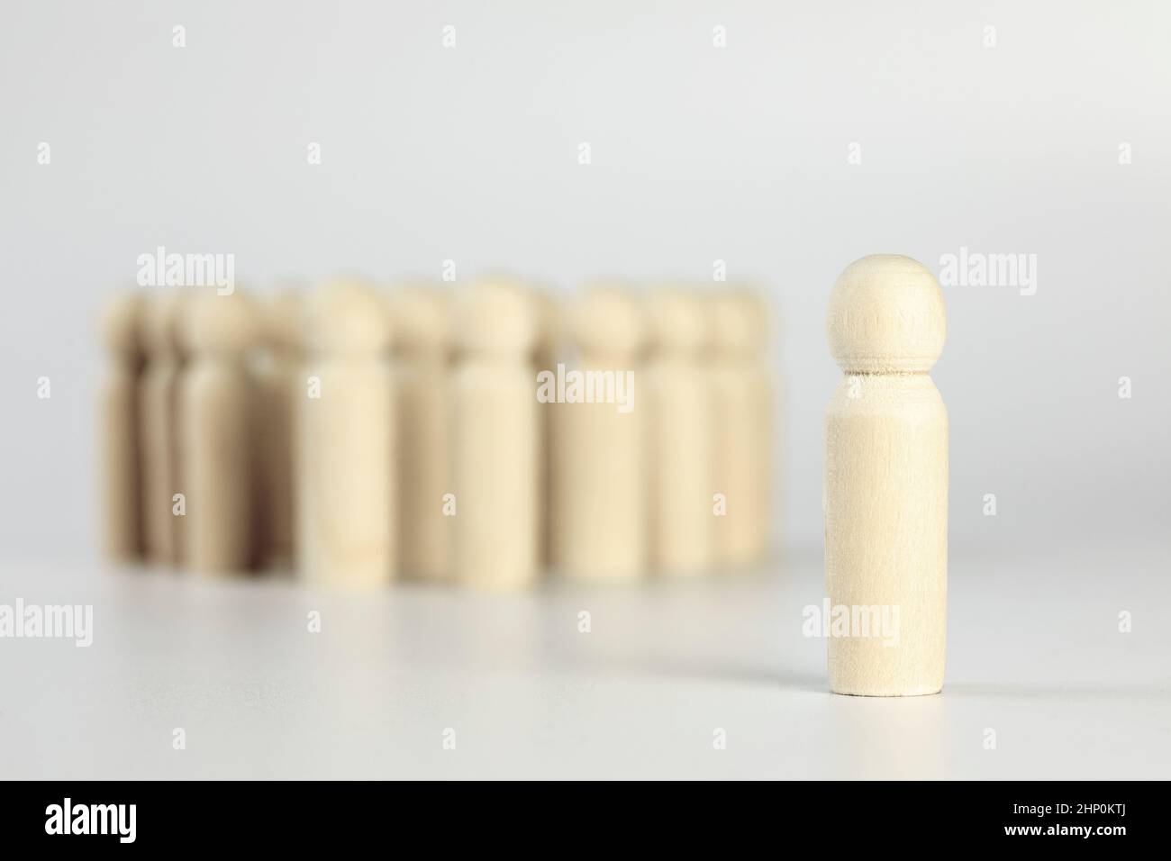 Group of people, one person standing out of the crowd, different or ...