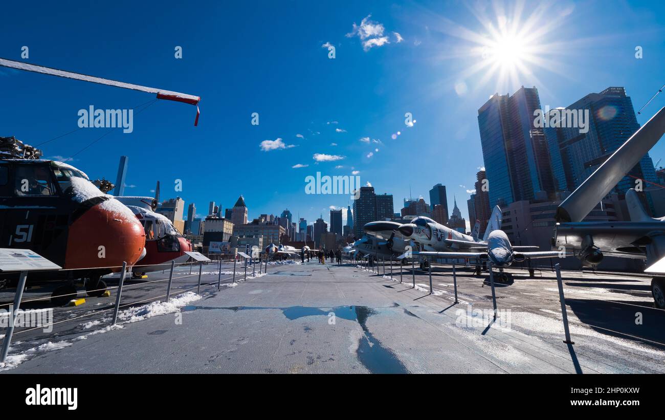 View of helicopters and airplanes parked on the flight deck of the ...