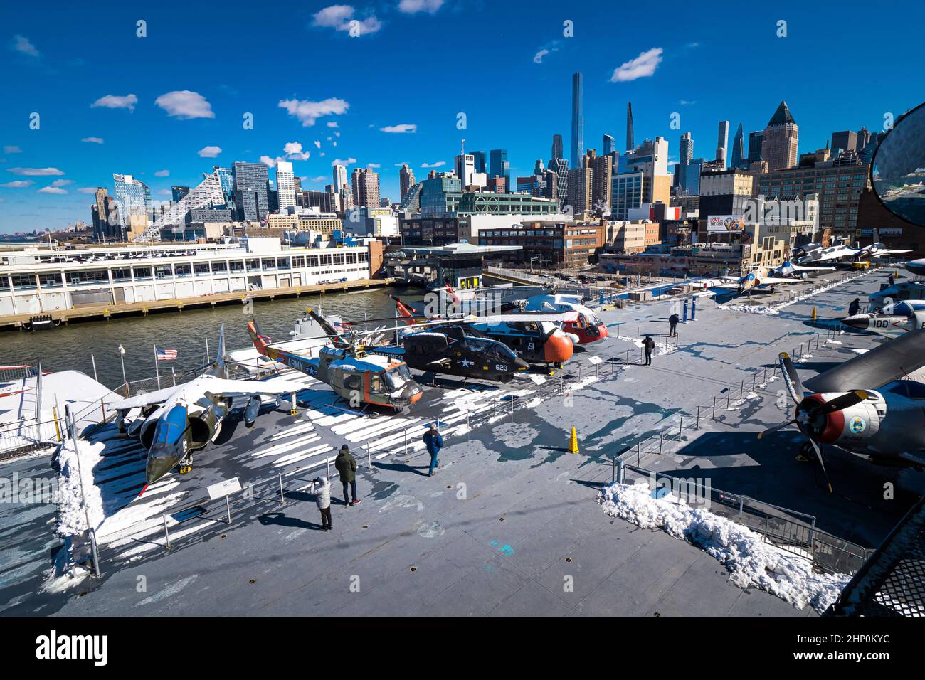 View of helicopters parked in line on the flight deck of the aircraft ...