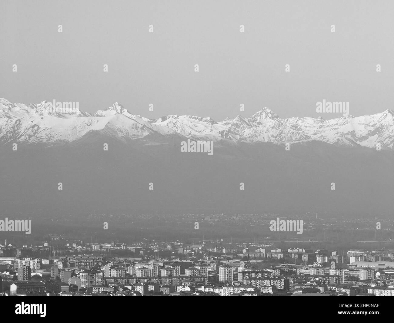 Aerial view of the city of Turin, Italy with Alps mountain range in the ...