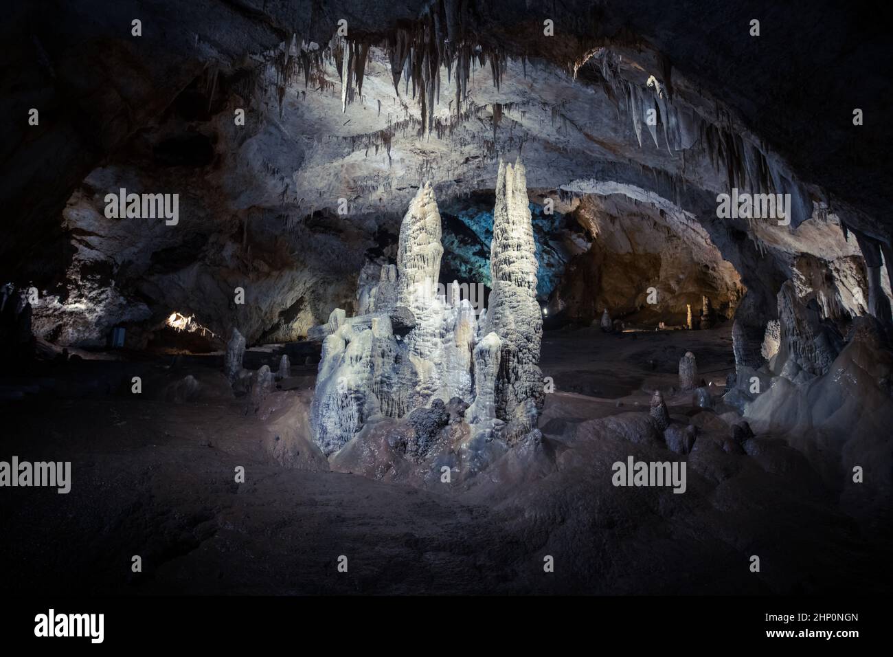 Image of a giant stalagmite in a an underground cave Stock Photo - Alamy
