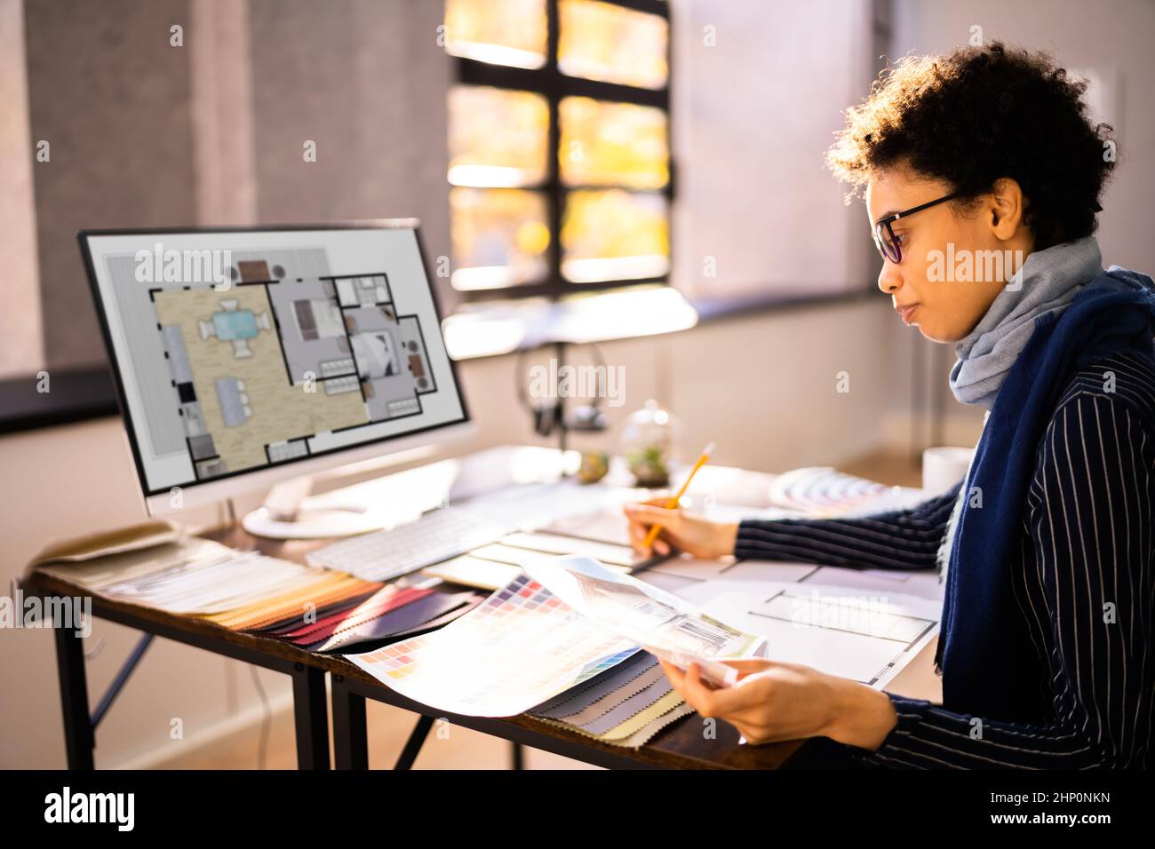 Side View Of Real Estate Designer Working On Computer In Office Stock ...