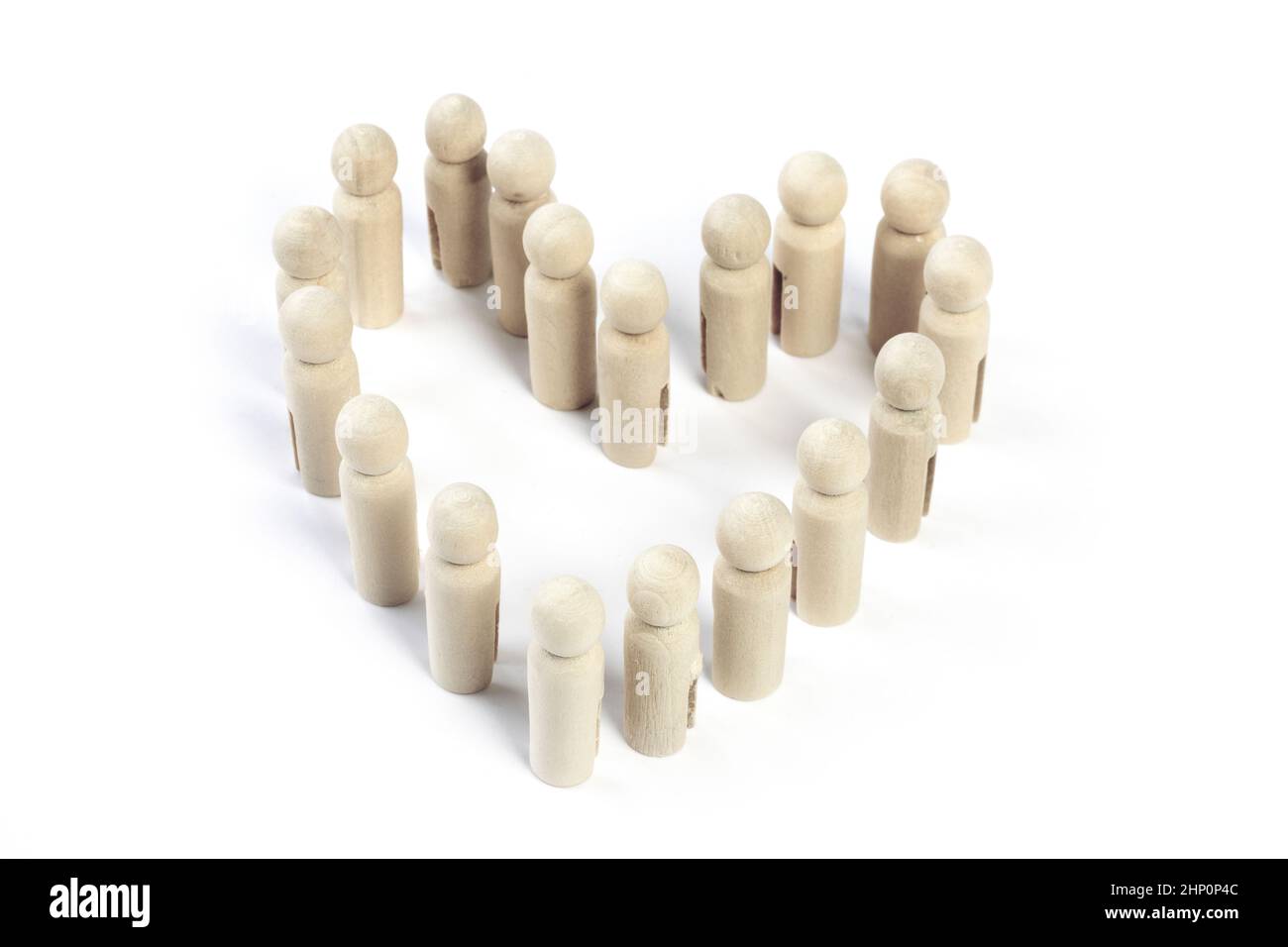Group of people standing together in heart shape isolated on white ...
