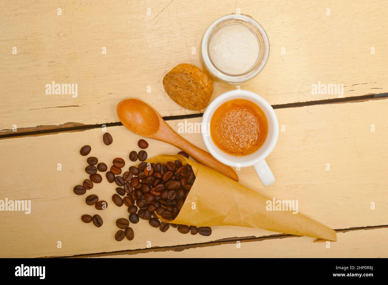 espresso coffee and beans on a paper cone cornucopia over white ...