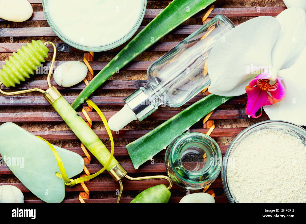 Cosmetic cream, face roller and guache scraper. Skin care facial ...