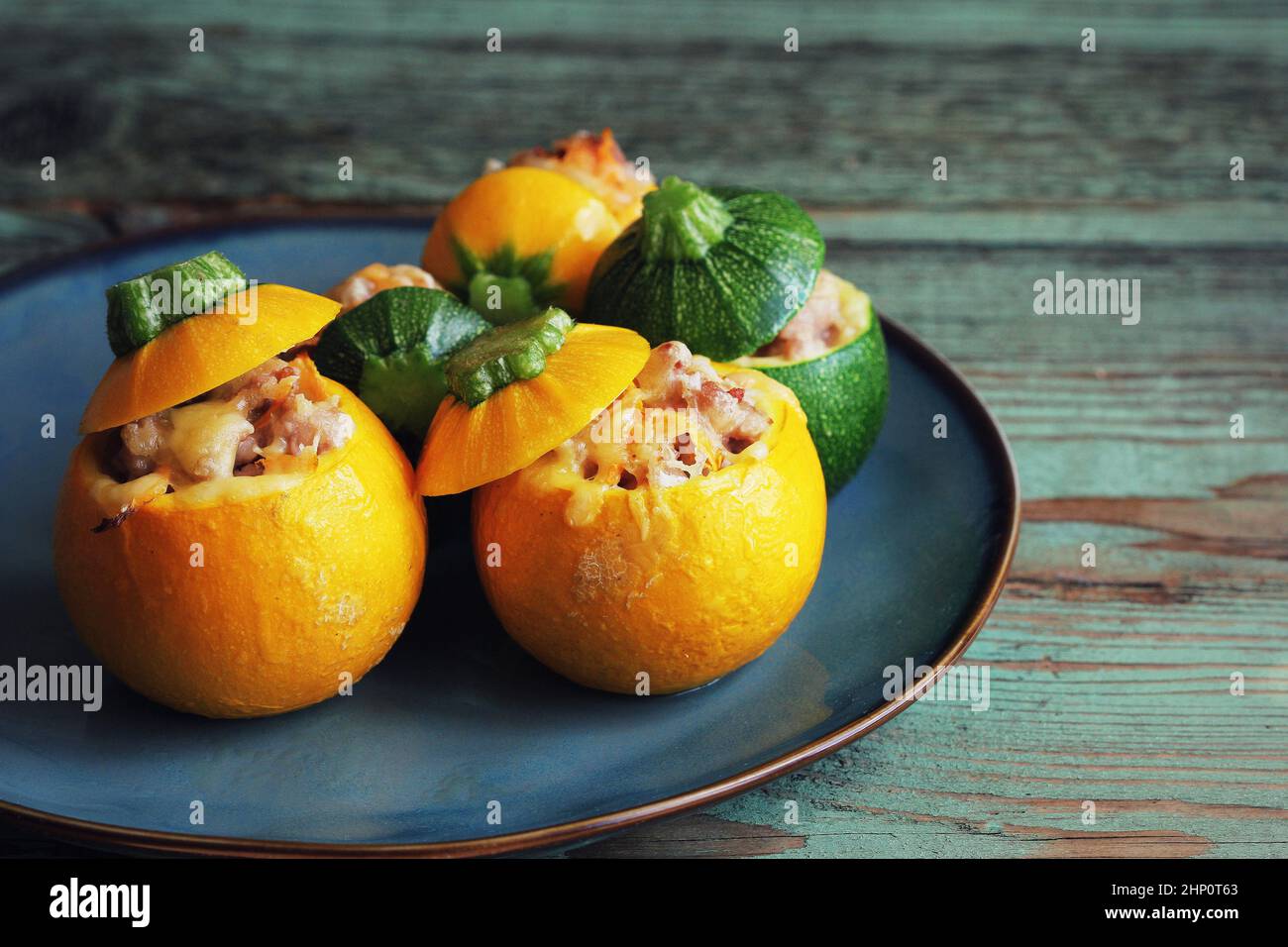 Baked round zucchini stuffed with minced meat, vegetables, and cheese ...