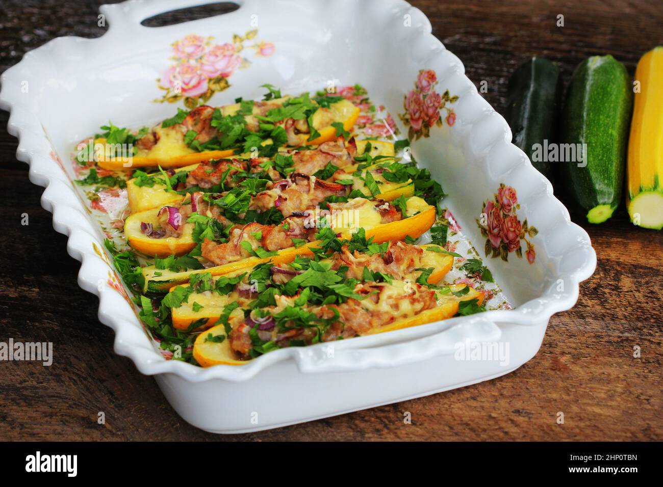 Zucchini stuffed with minced meat, cheese and mushroom. Baked in oven ...