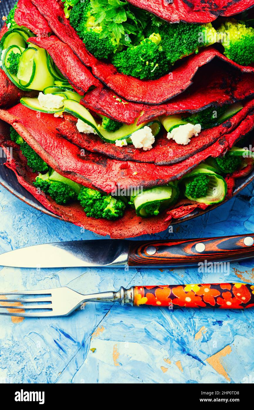 Fried beetroot pancakes with feta cheese, broccoli and cucumber ...