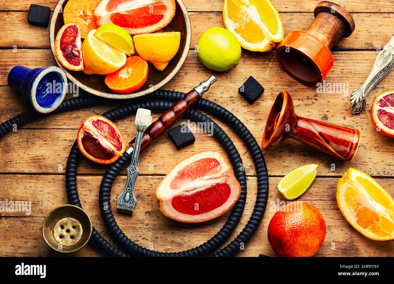Smoking kalian or shisha with tobacco from citrus fruits. Traditional ...