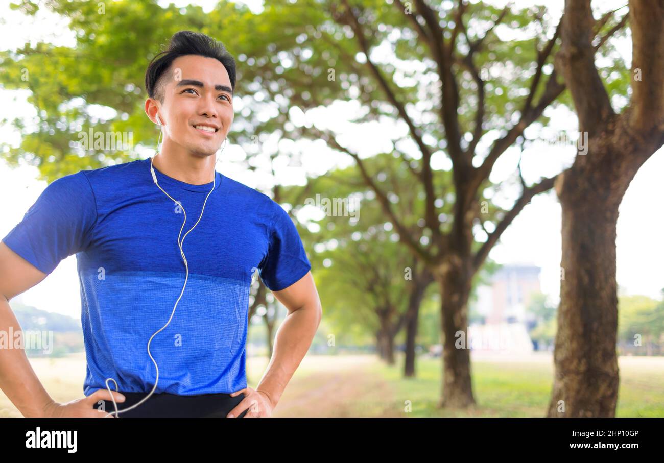 Young chinese man jogging in the park hi-res stock photography and ...