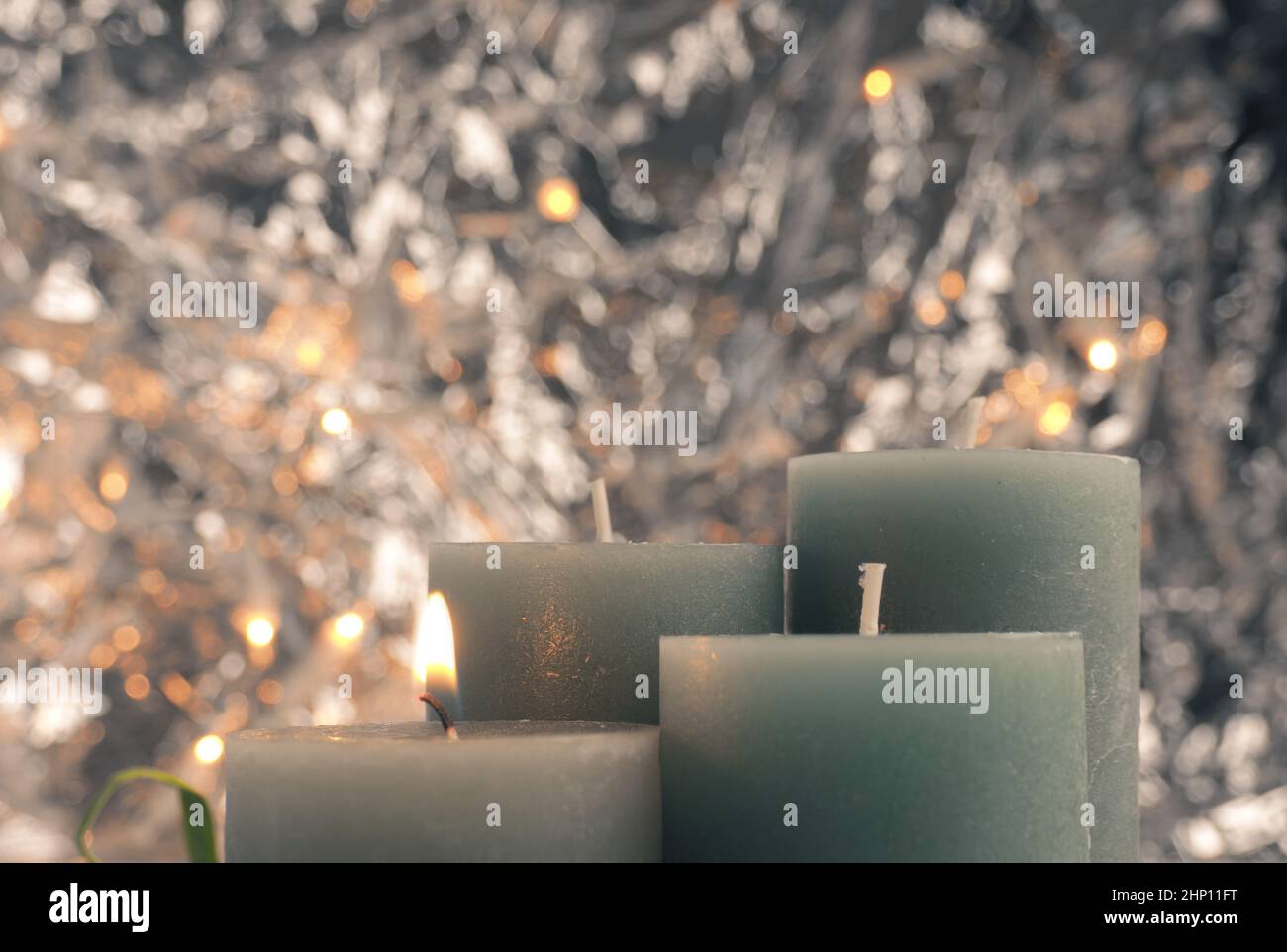 First Advent candle burns, silver background with text free space Stock ...
