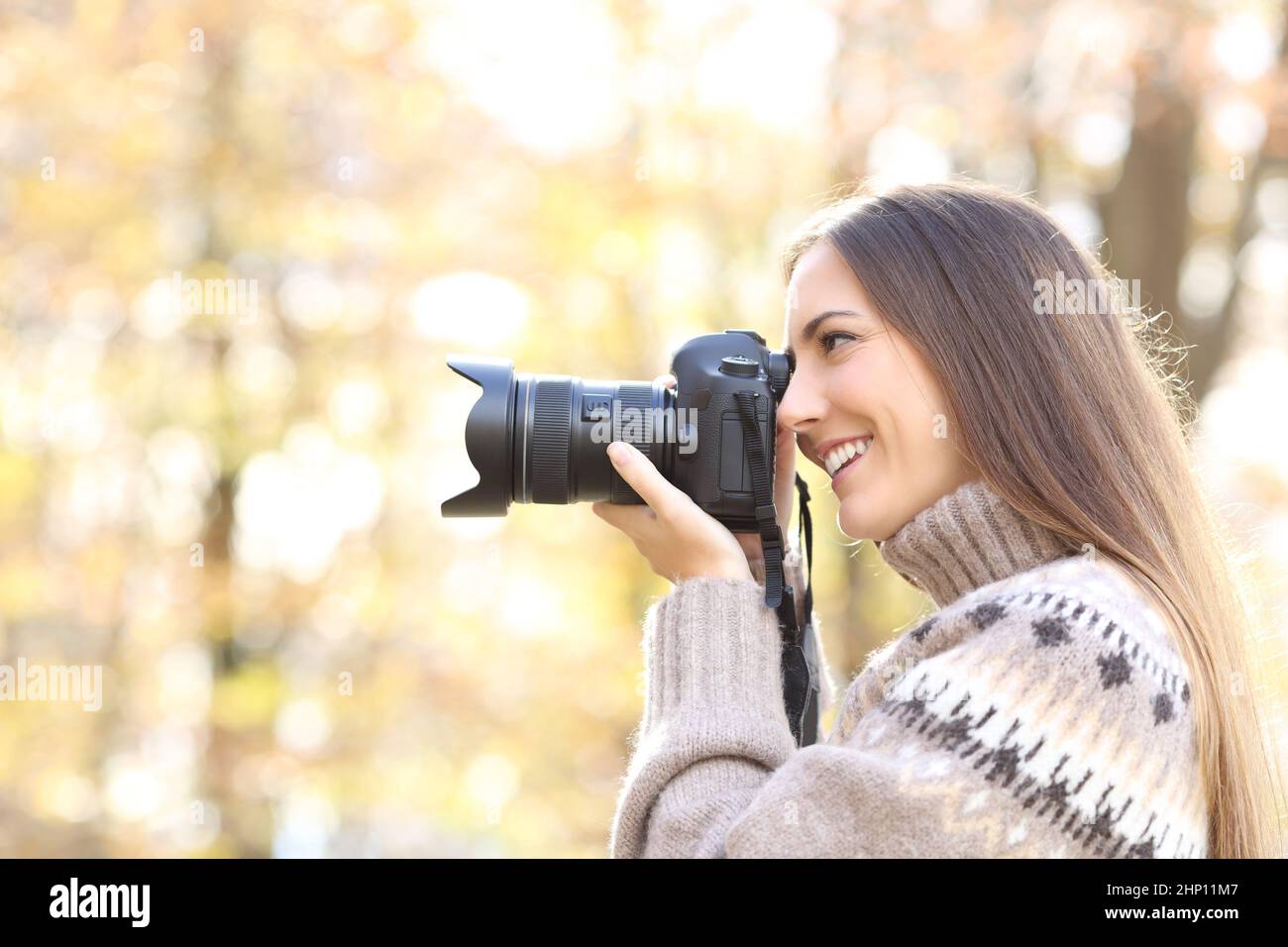 Girl with camera in her hands taking photos hi-res stock photography ...