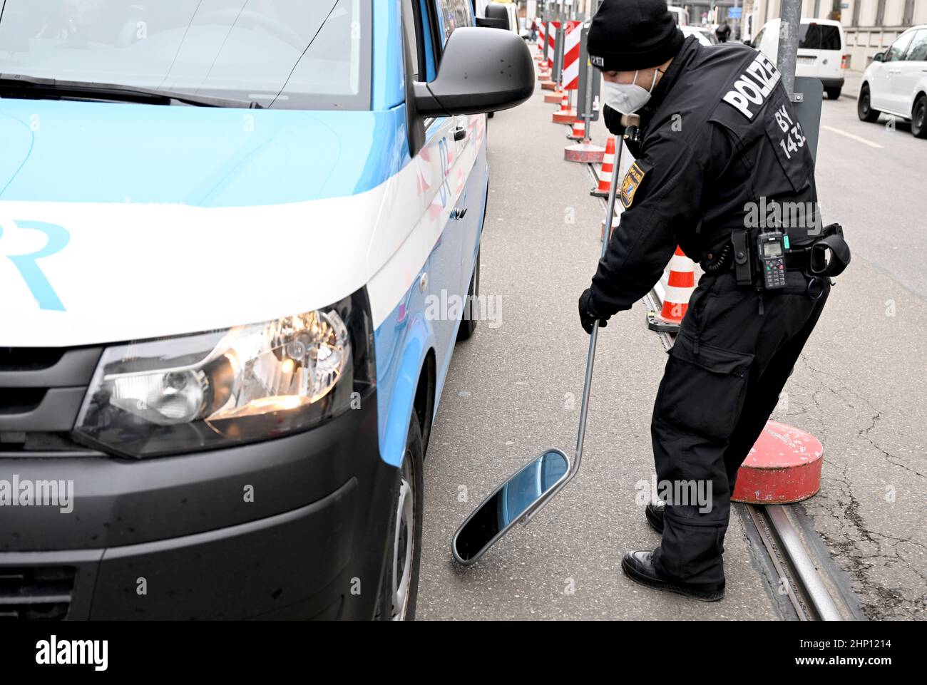Munich, Germany. 18th Feb, 2022. A policeman checks a Bayerischer ...
