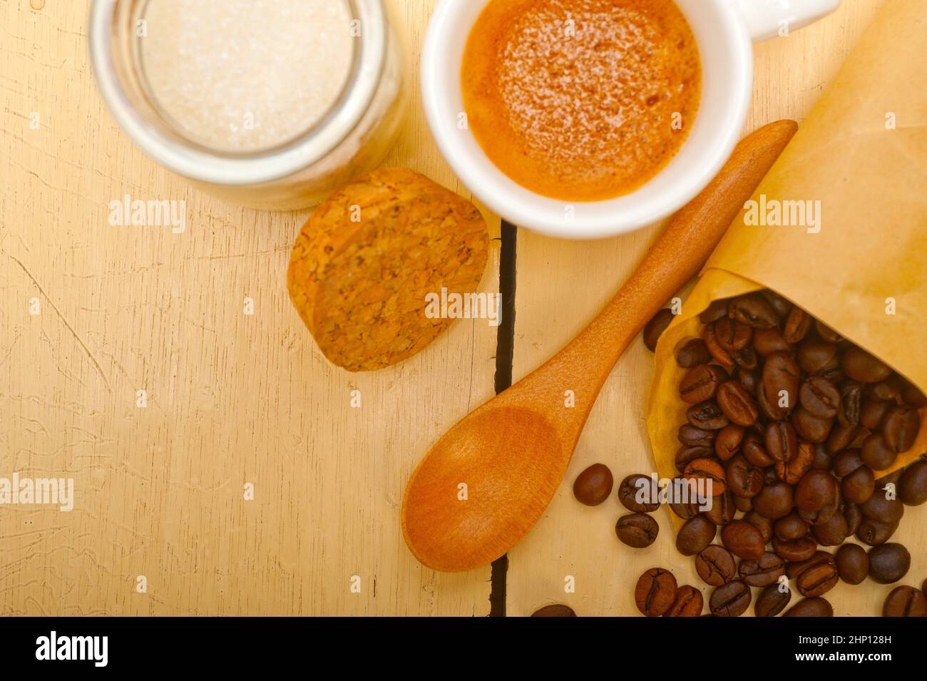 espresso coffee and beans on a paper cone cornucopia over white ...