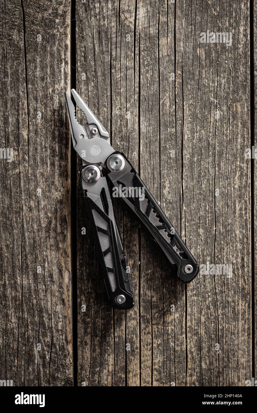 Multi-tools pliers with other tools and knife. Multifunction pliers on ...