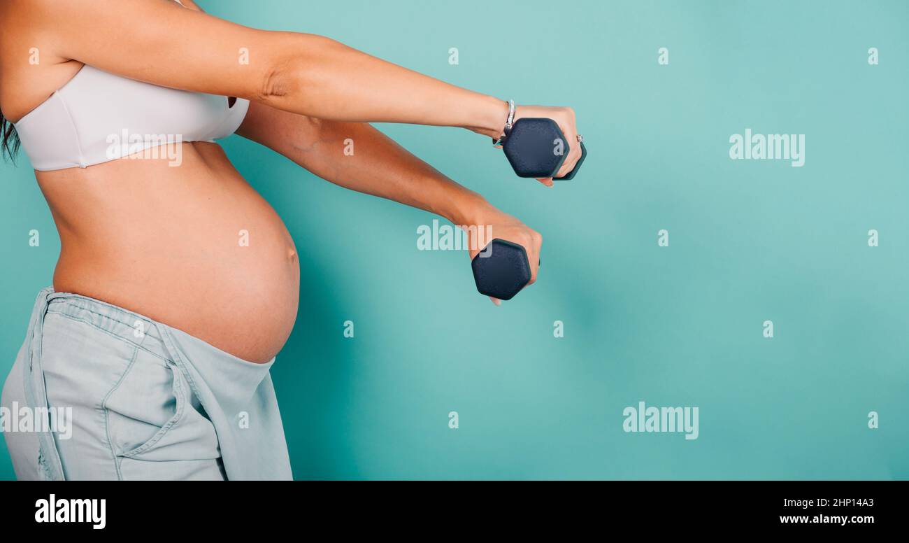 woman expecting a child caresses her belly Stock Photo - Alamy