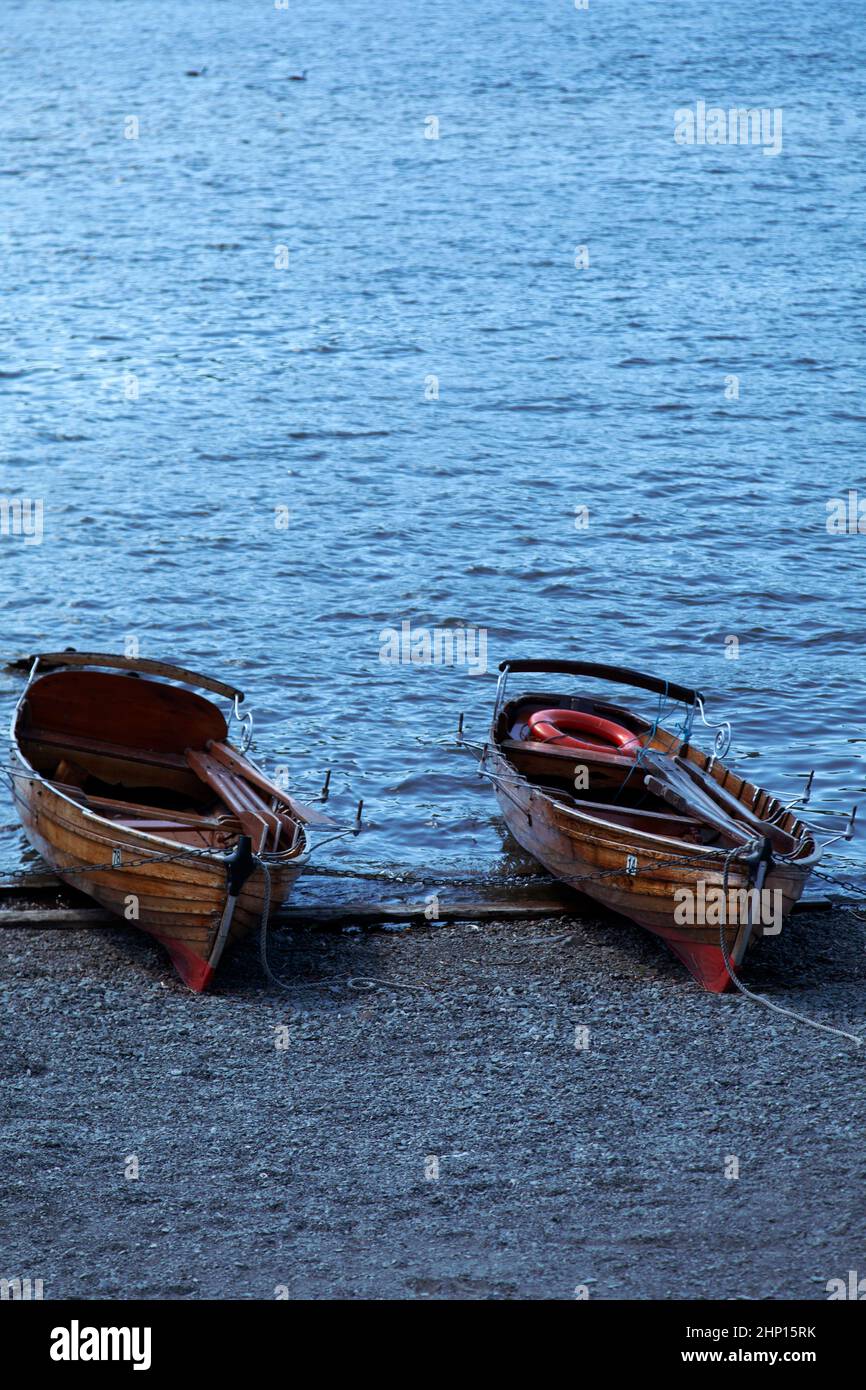 Two Rowing Boats on lake Shore Stock Photo - Alamy