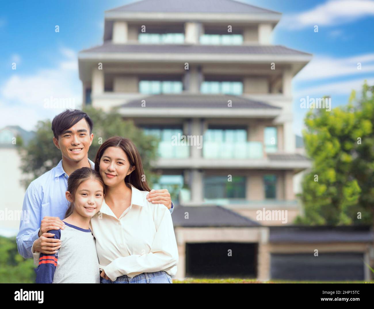 Happy family stand outside before their new house Stock Photo - Alamy