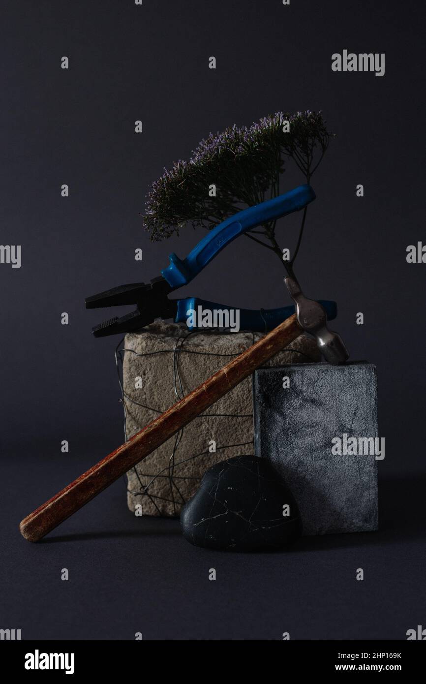 concept art still life with a stone in the metal wire, sanding sponge ...