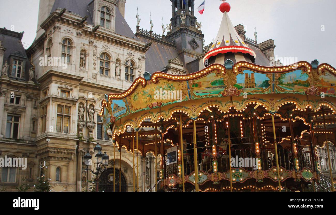 Carousel in movement near the city hall in Paris, France Stock Photo ...