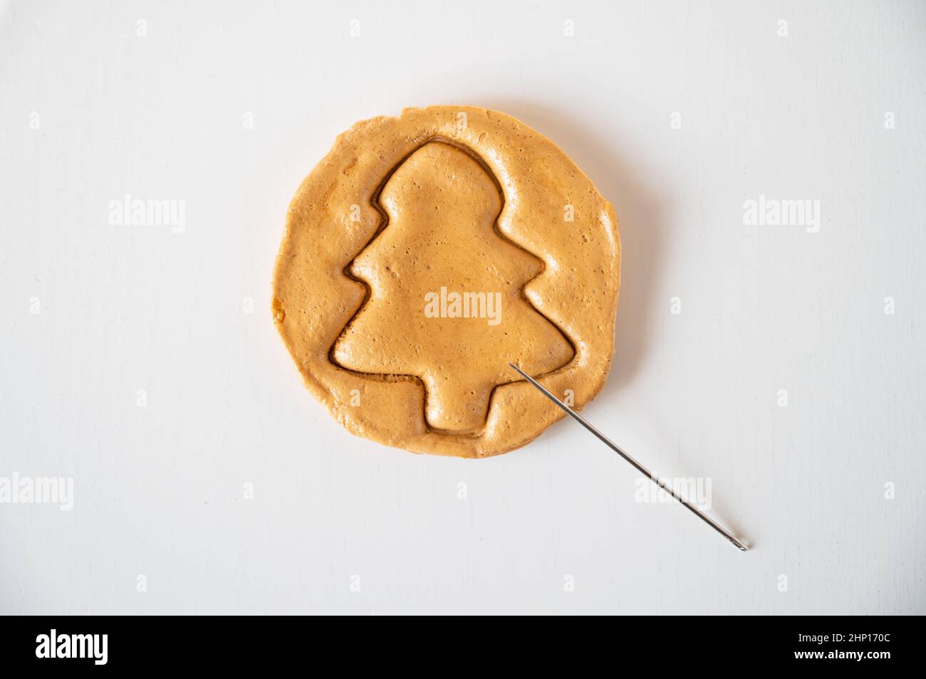 Brown sugar caramel candy cookies with a metal needle in the shape of a ...