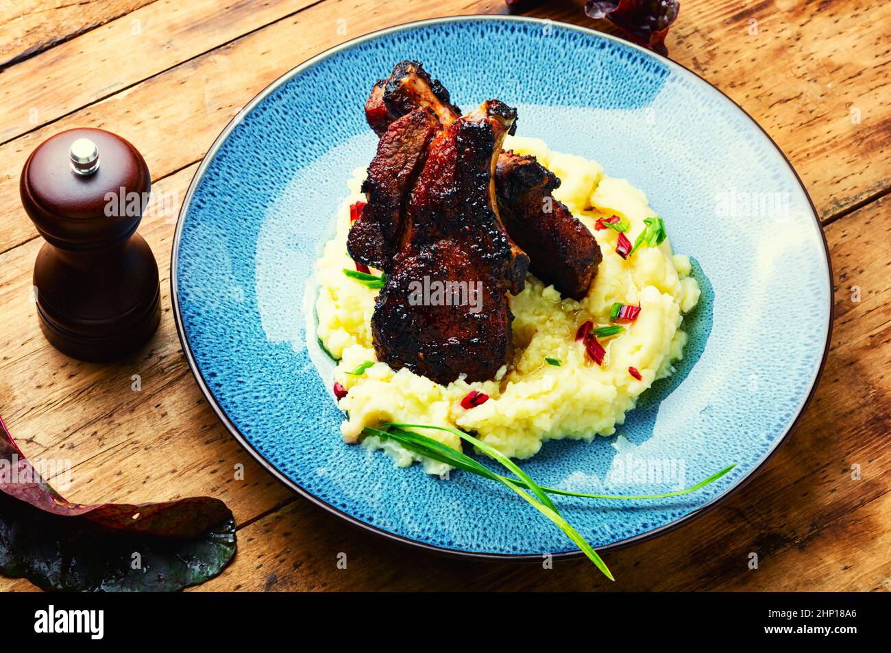 Grilled meat steak on the bone and mashed potatoes Stock Photo - Alamy