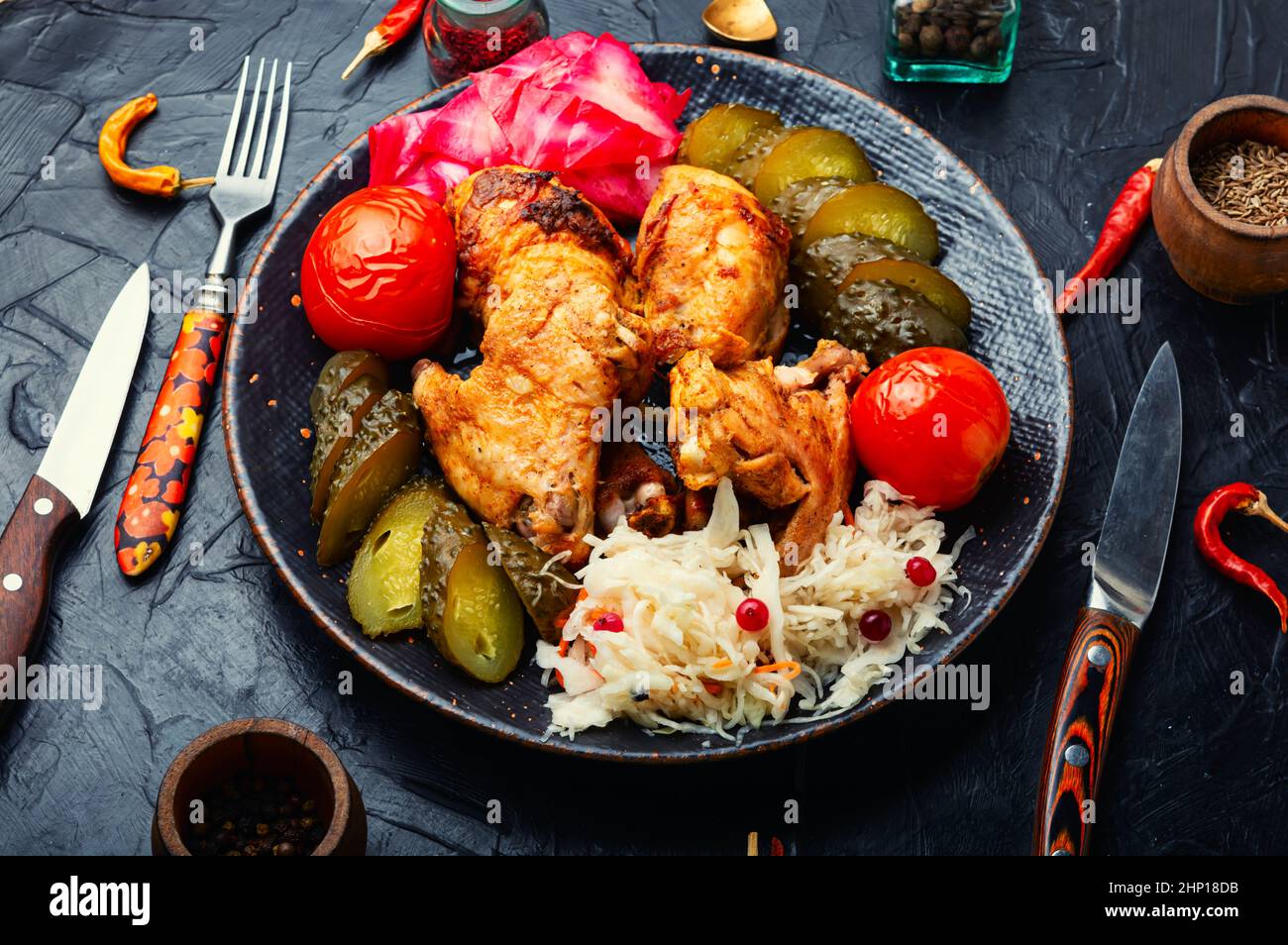 Fried chicken meat and a side dish of pickles. English cuisine Stock ...