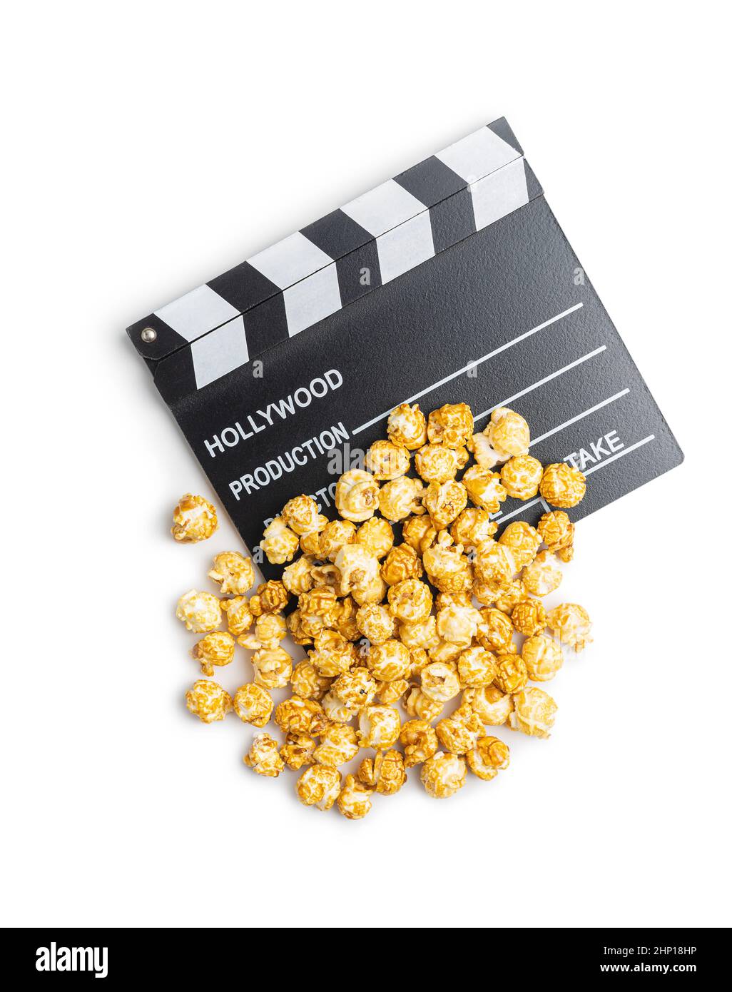Sweet caramel popcorn and clapper board isolated on white background ...