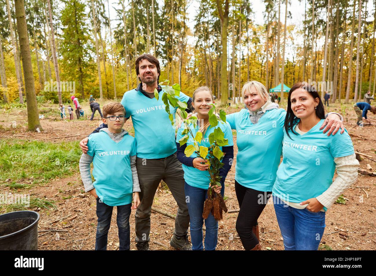 Happy family with children as an environmentalist team at an ecological ...