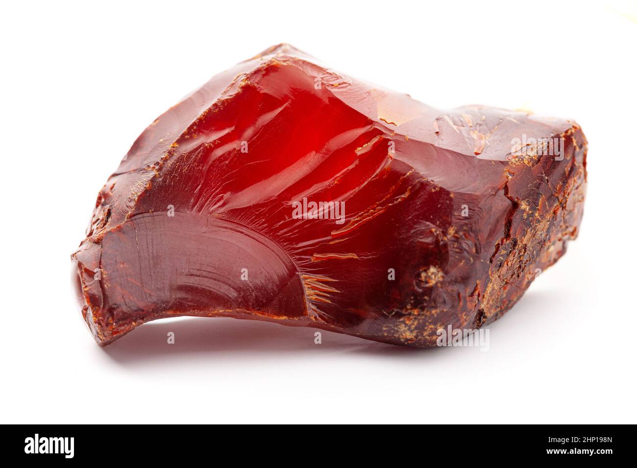 A piece of yellow opaque natural amber classification color cherry or ...