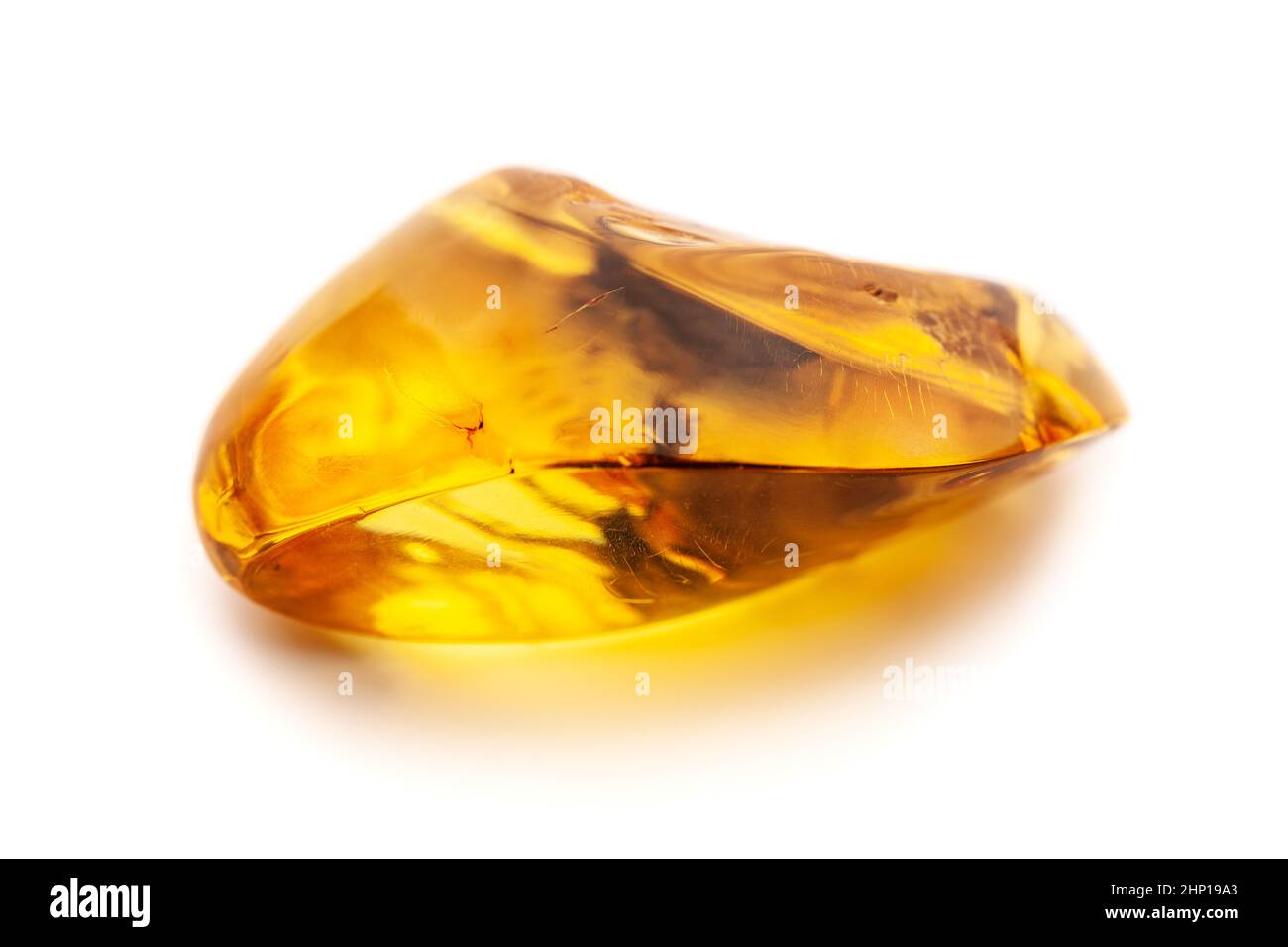 A piece of yellow opaque natural amber classification color Clear ...