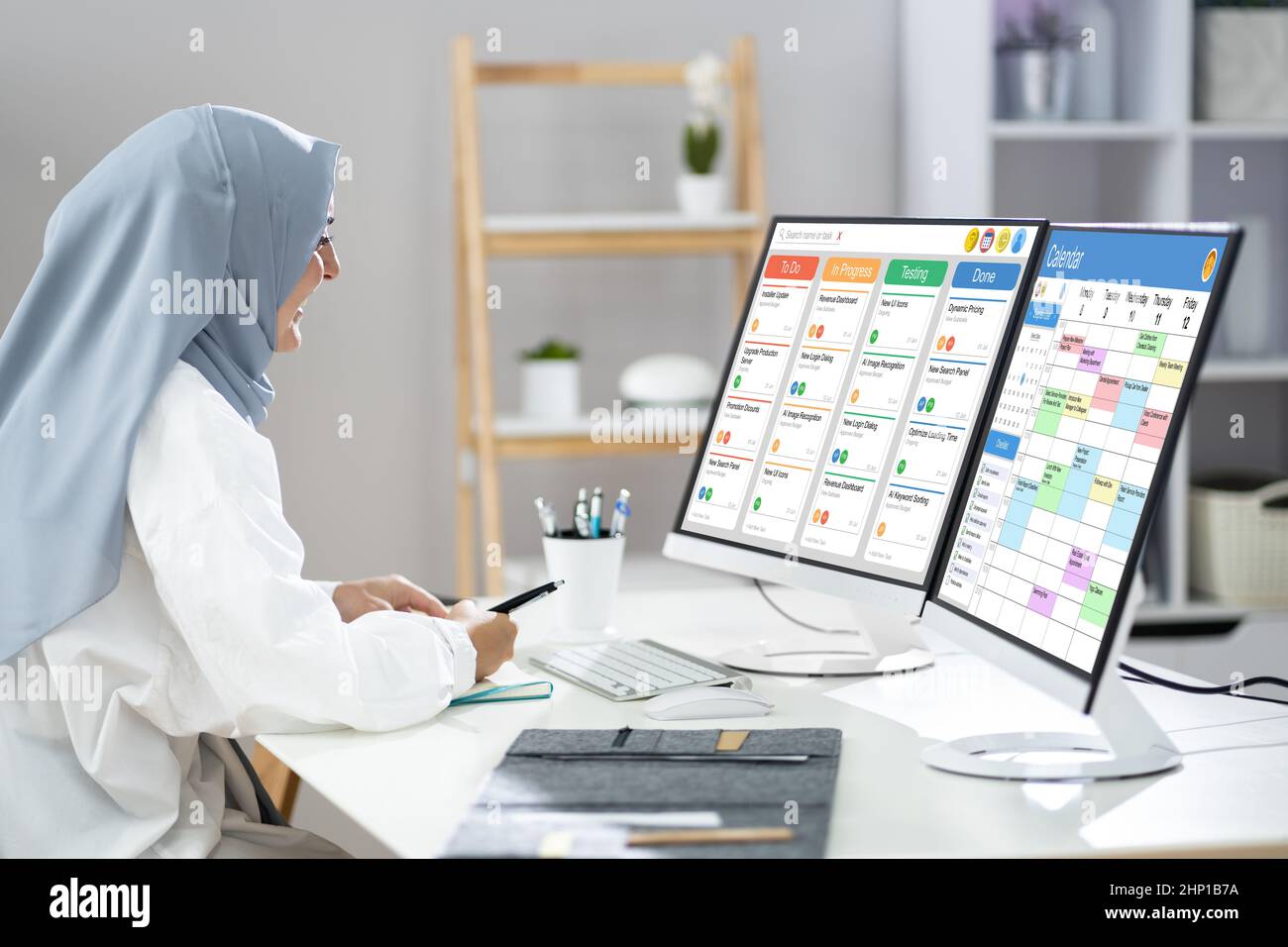 Muslim Woman Working Gantt Schedule Report And Calendar Stock Photo - Alamy