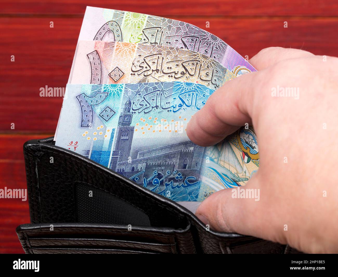 Kuwaiti money - Dinar in the black wallet Stock Photo - Alamy