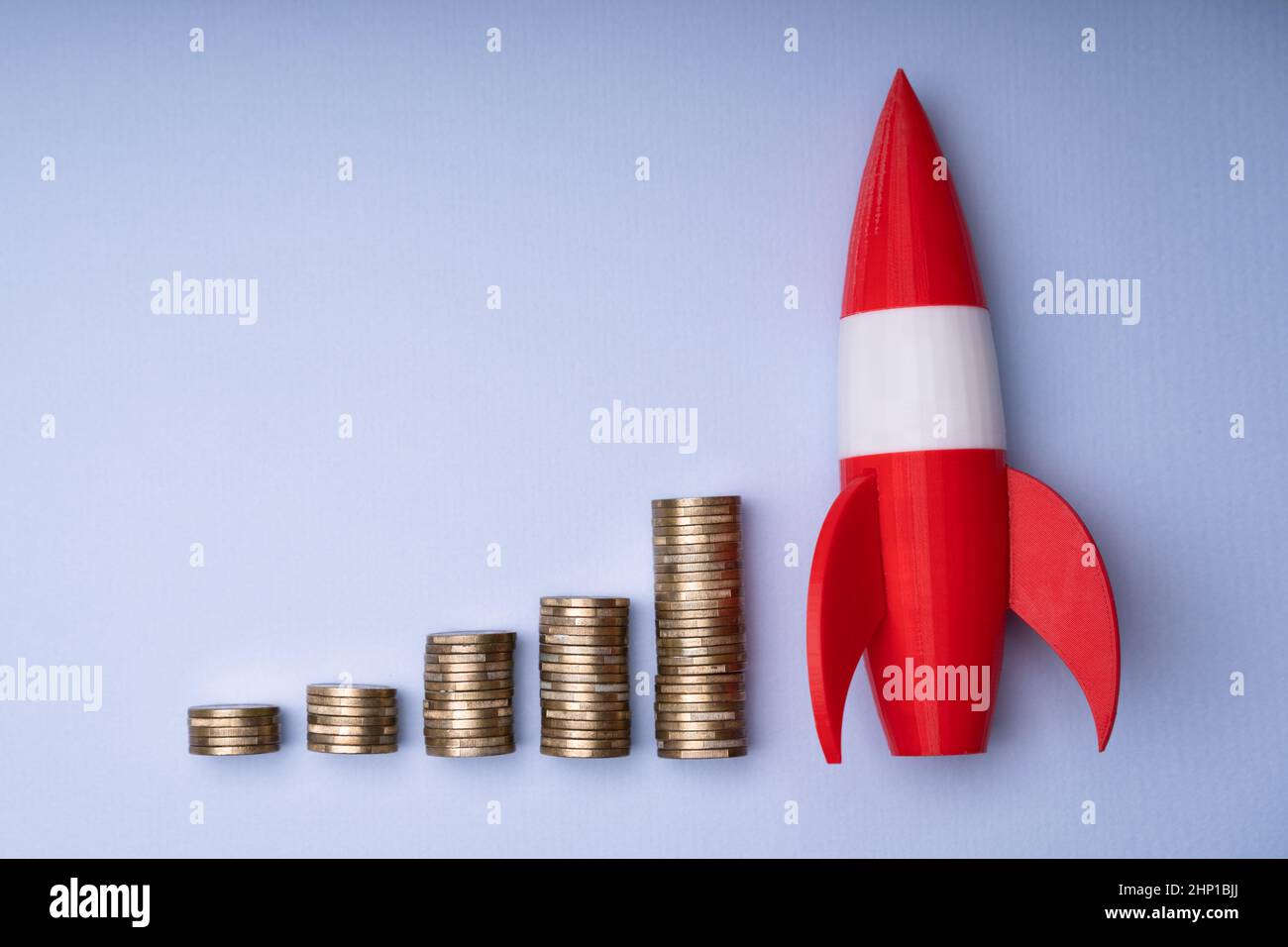 Rocket Upward Money Increase, Coin Stack Graph Stock Photo - Alamy