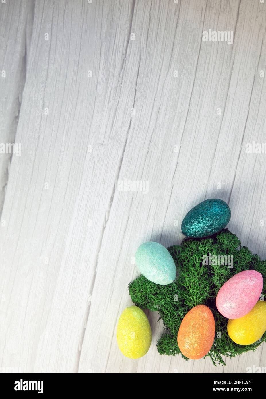 Happy Easter holliday concept, colorful easter eggs with green moss on ...