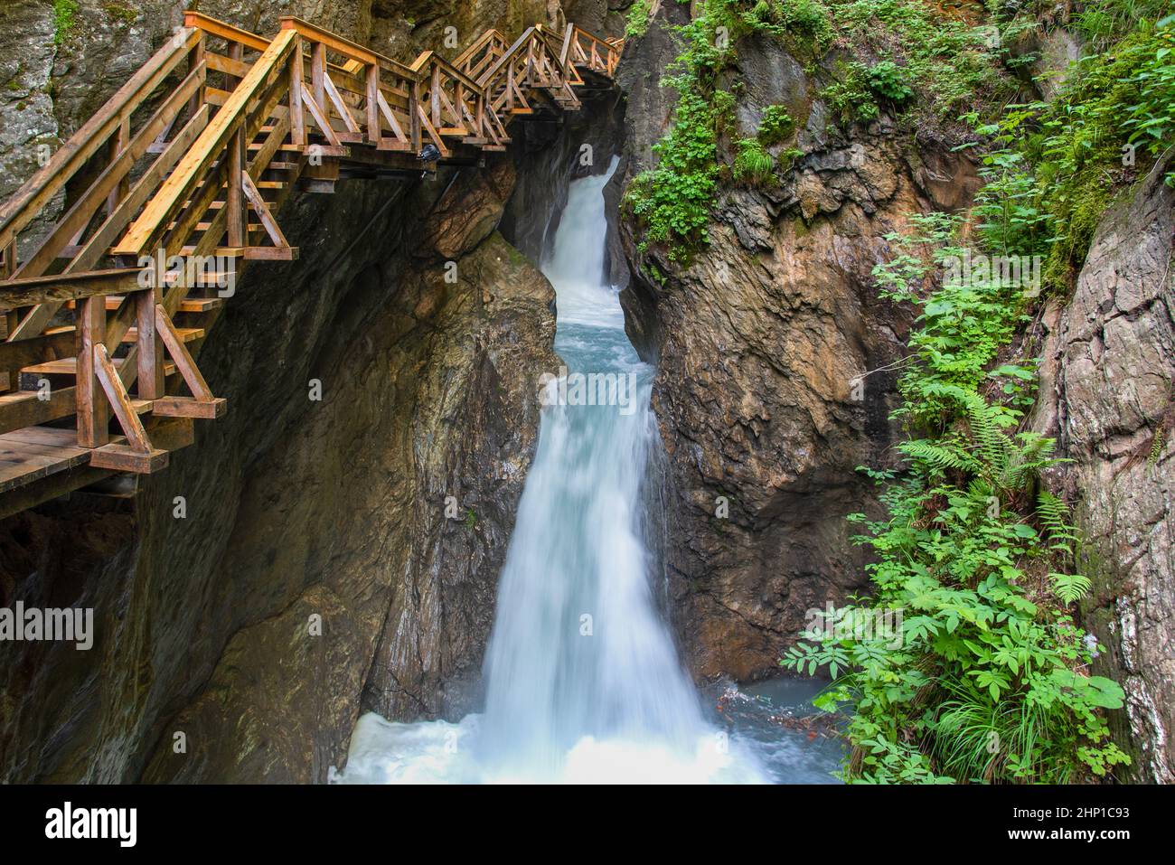 Walking through the Sigmund-Thun Klamm with wooden walkways near Kaprun ...